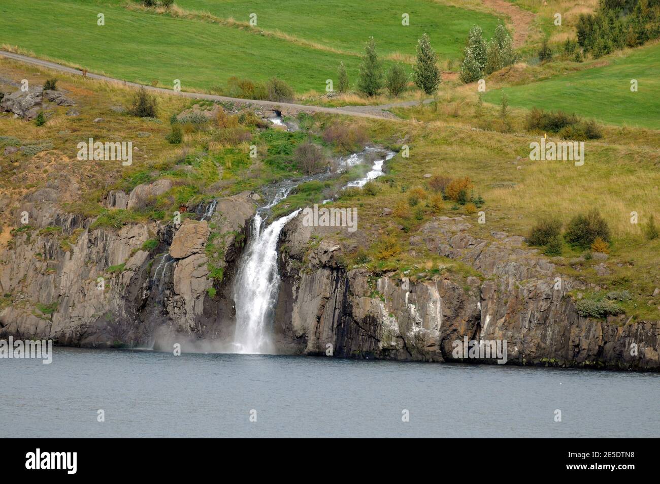 Hot Spring falling into Eyjafjordur Stock Photo - Alamy