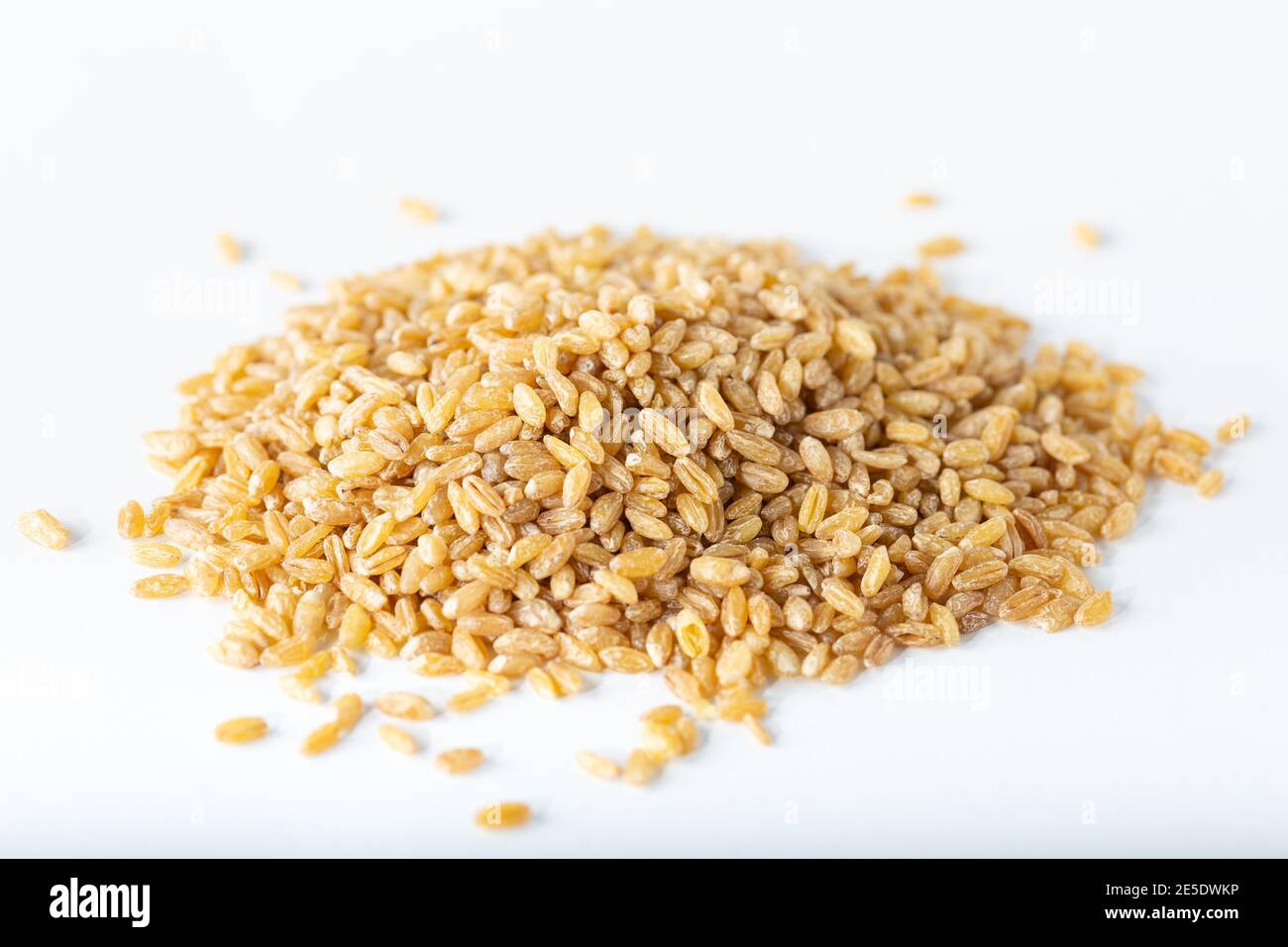 Uncooked bulgur wheat on the isolated on white background Stock Photo ...