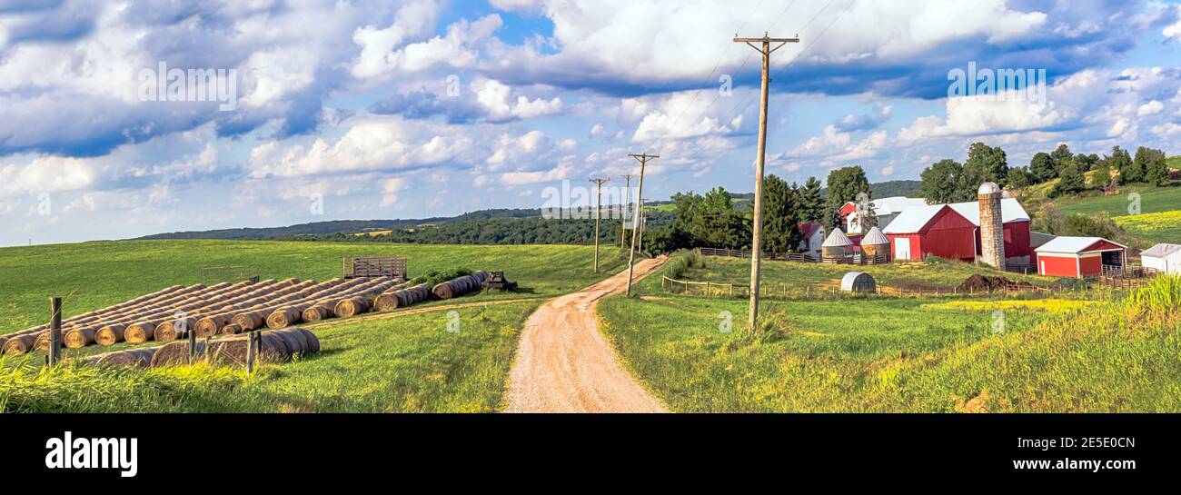 A country road cutting through a farm on top of a ridge in rural Ohio ...