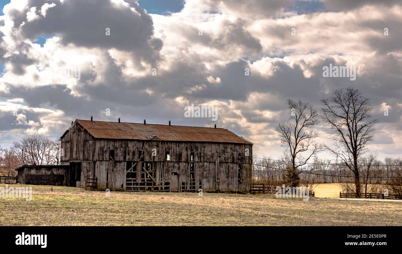 Old, dilapidated barn in rural Kentucky in February with dramatic ...