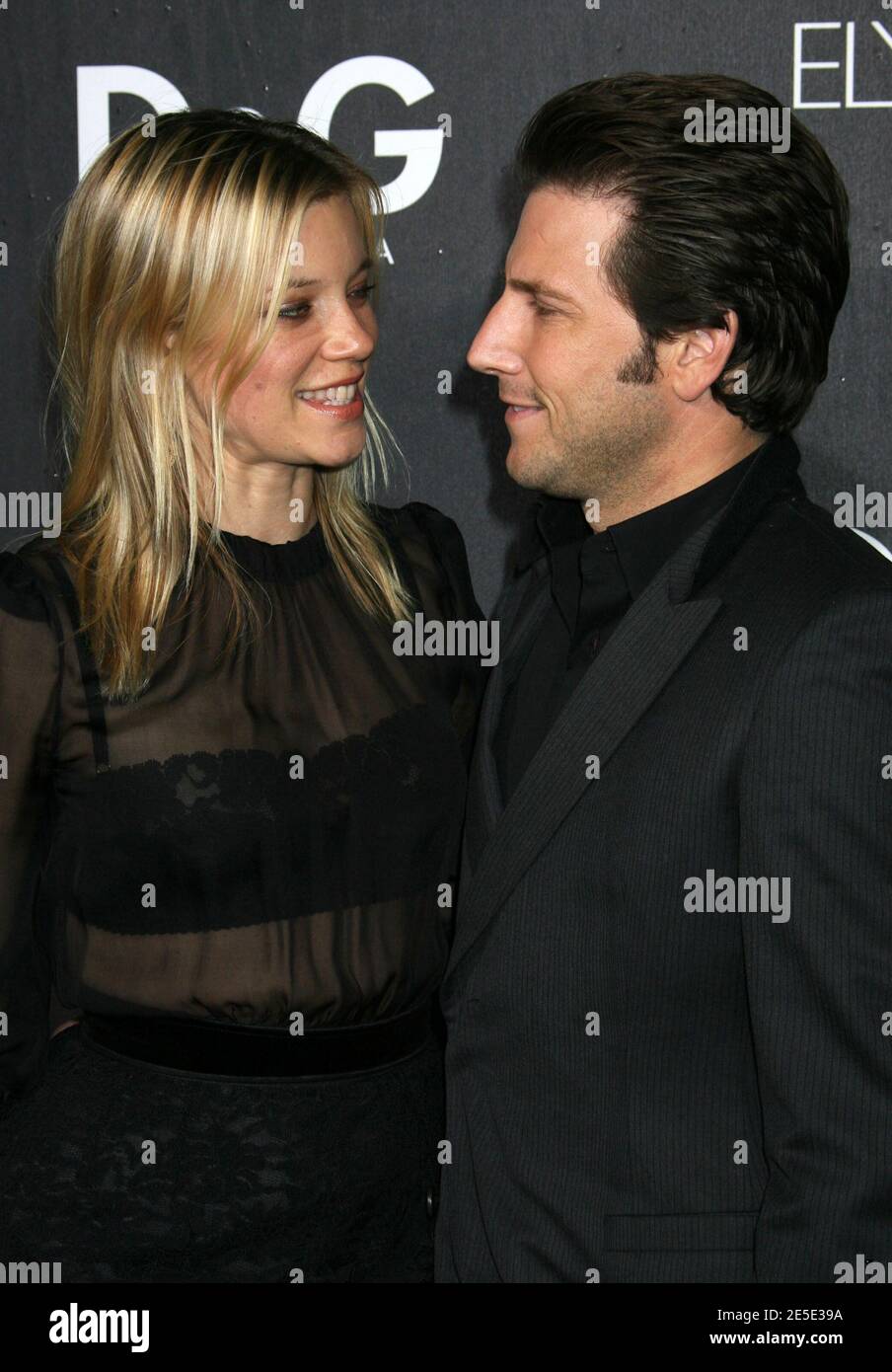 Amy Smart and guest arriving at the Dolce & Gabbana boutique opening ...