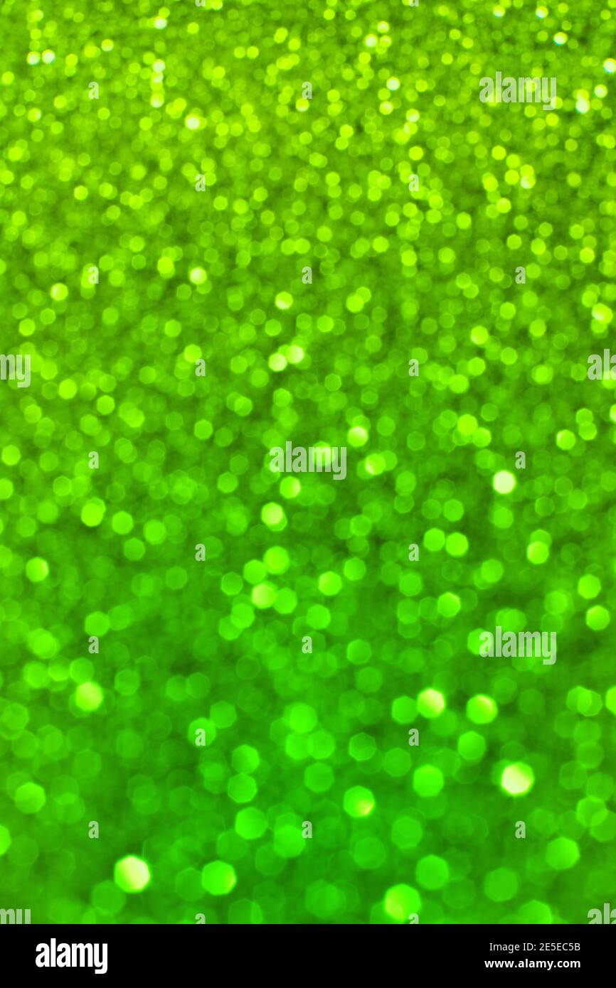 Abstract emerald green glitter bokeh background. Festive backdrop for ...