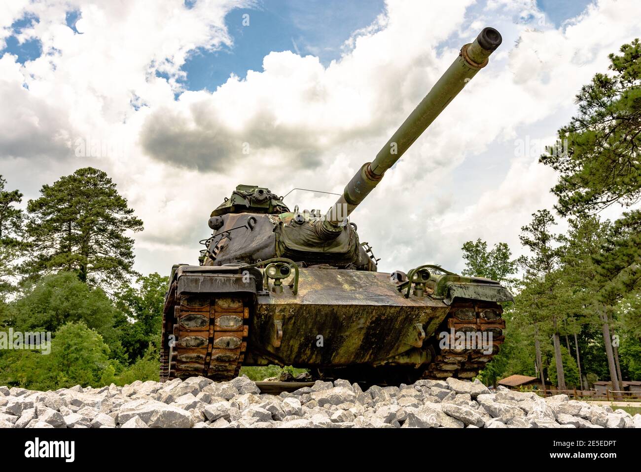 World War II era tank with blue sky and clouds - horizontal format ...