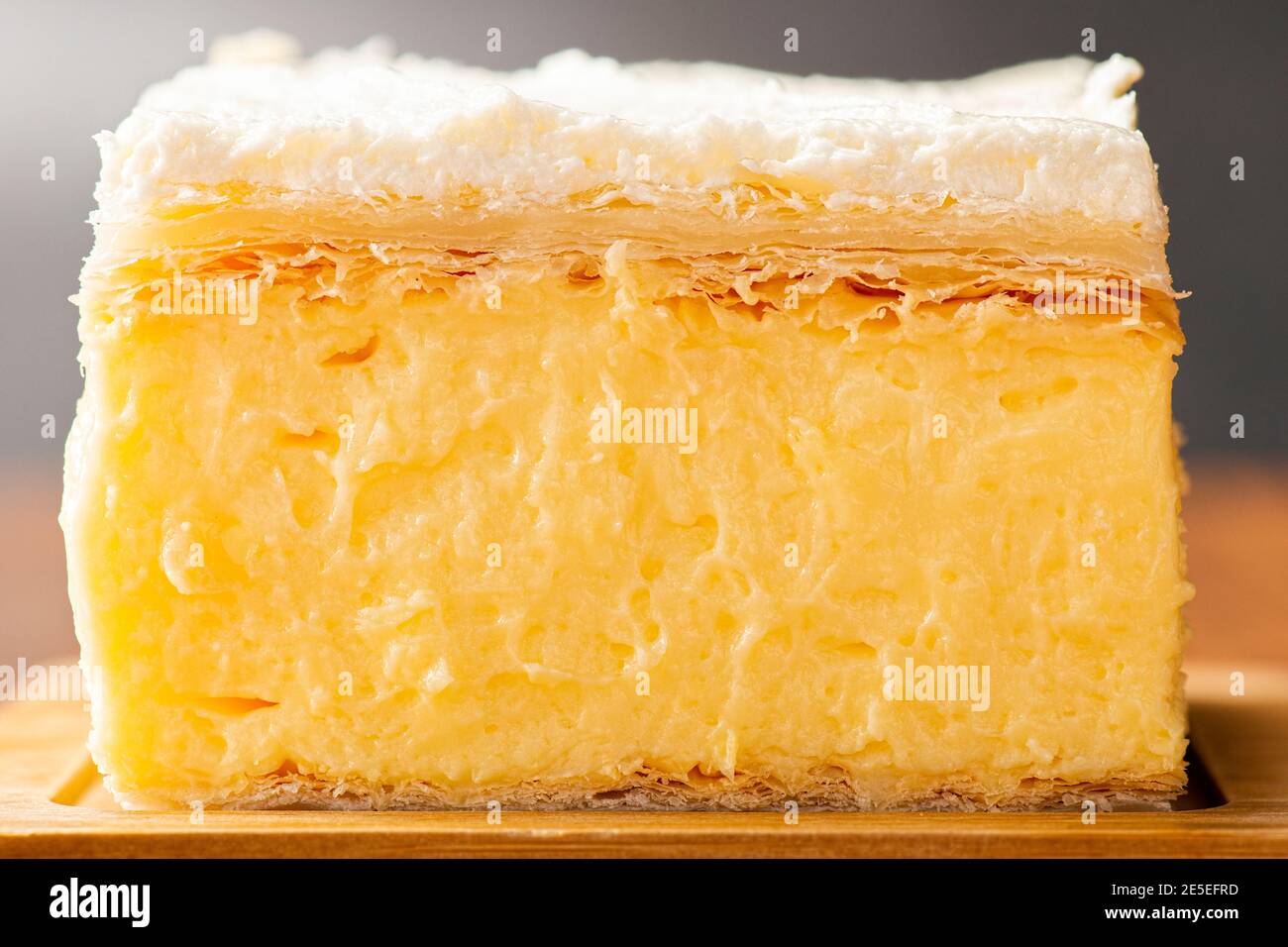 Delectable vanilla slice with custard and buttercream icing Stock Photo ...