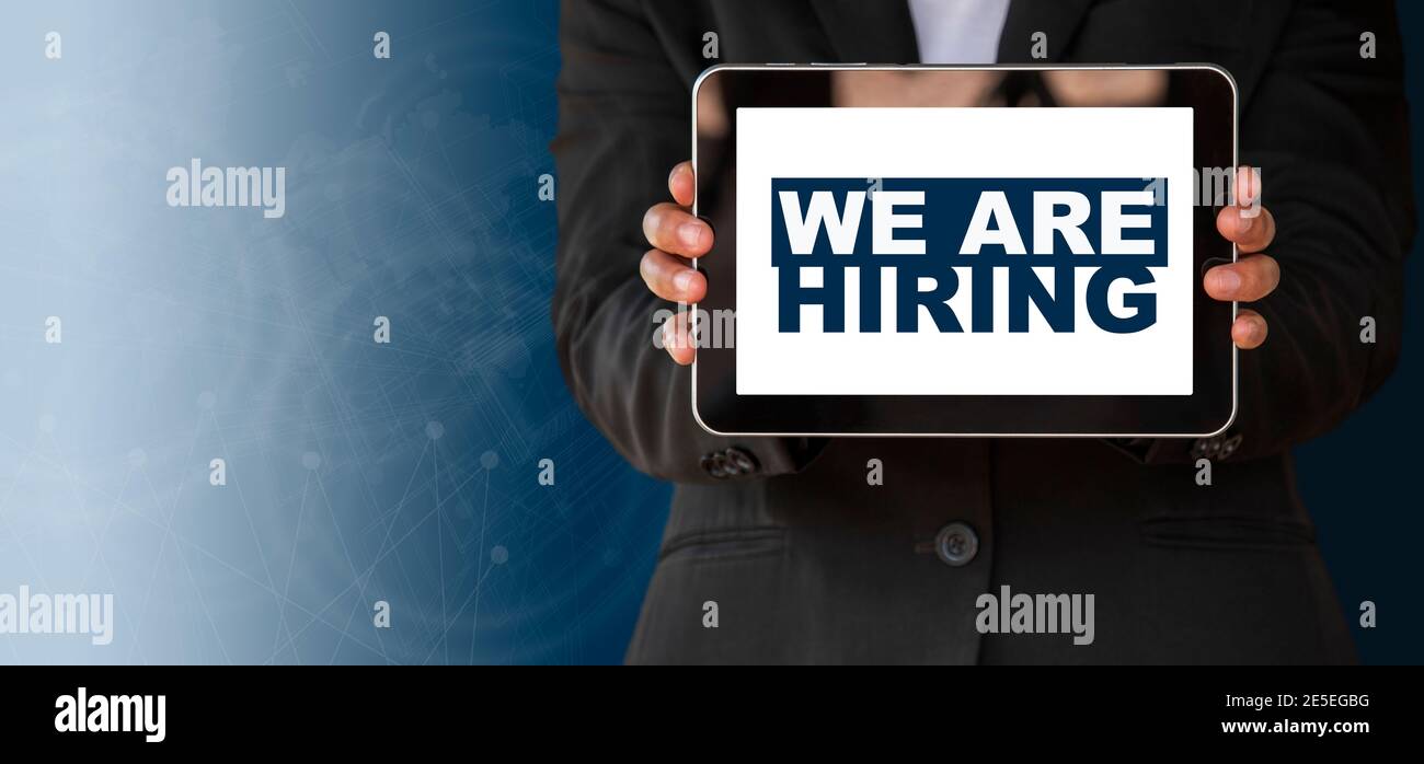 Concepts for finding personnel to join work, Person holding a tablet ...