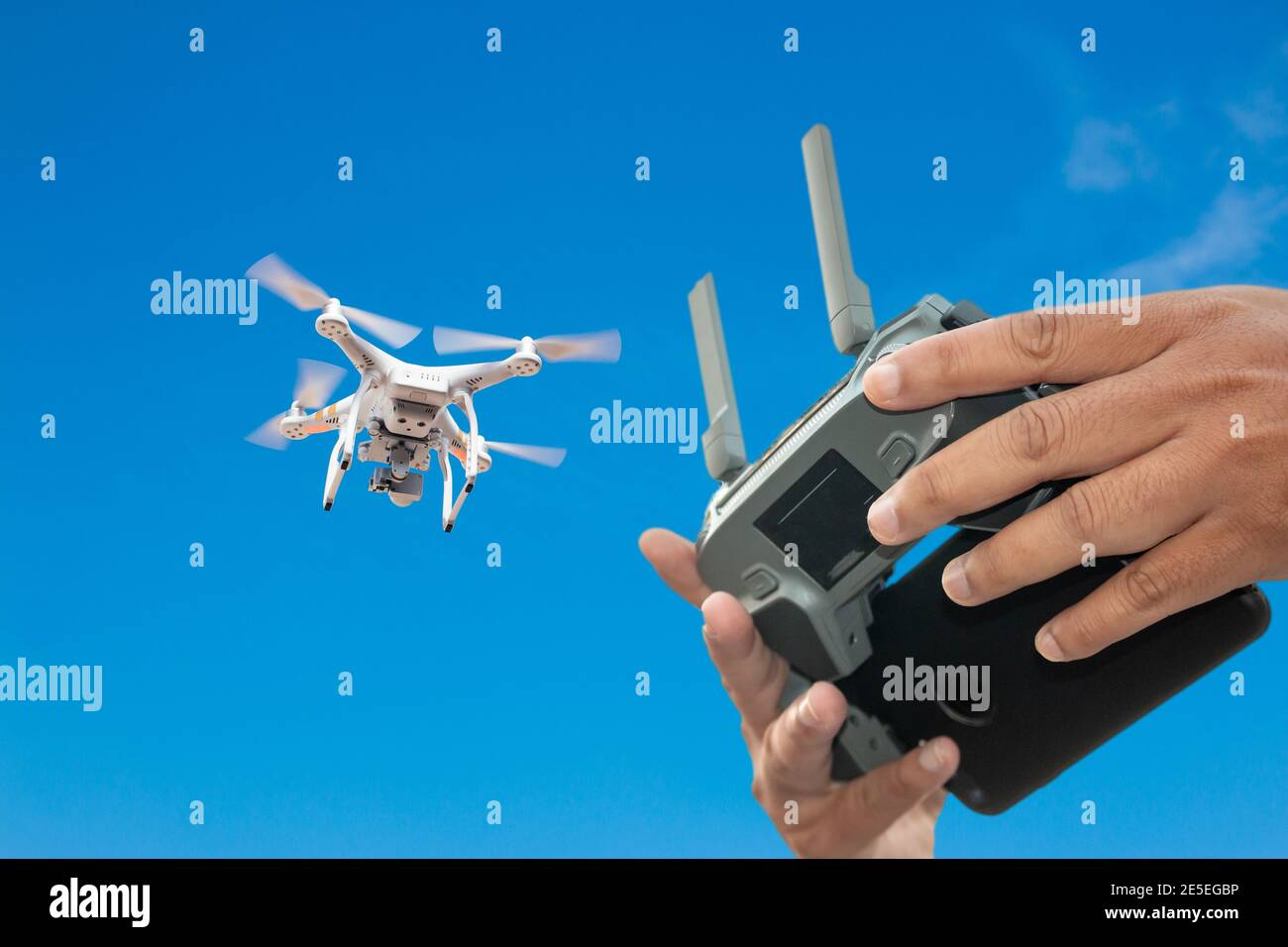 hands with remote controller of drone outside Stock Photo - Alamy