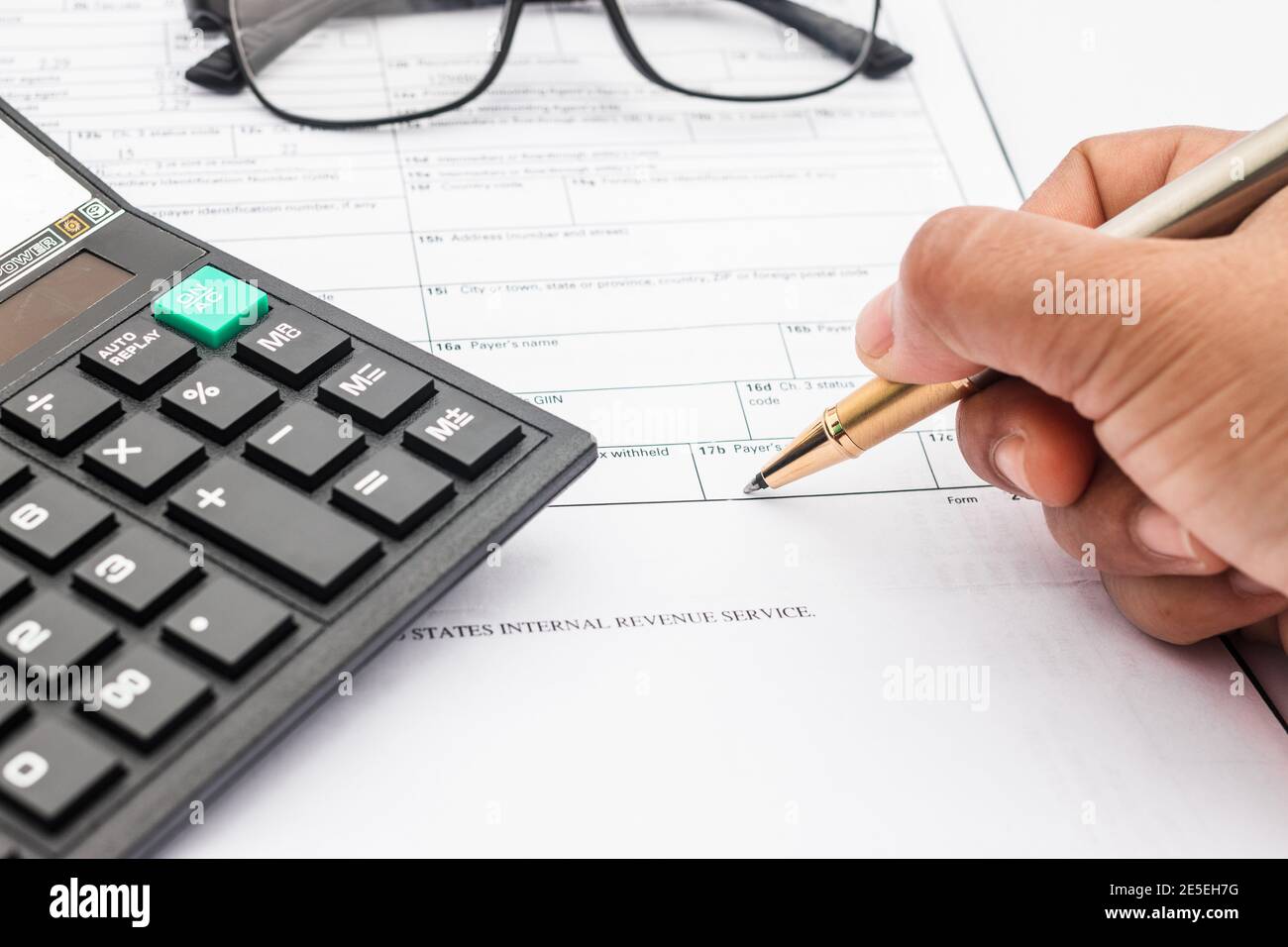 calculator and documents for working on the table, Finance and savings ...