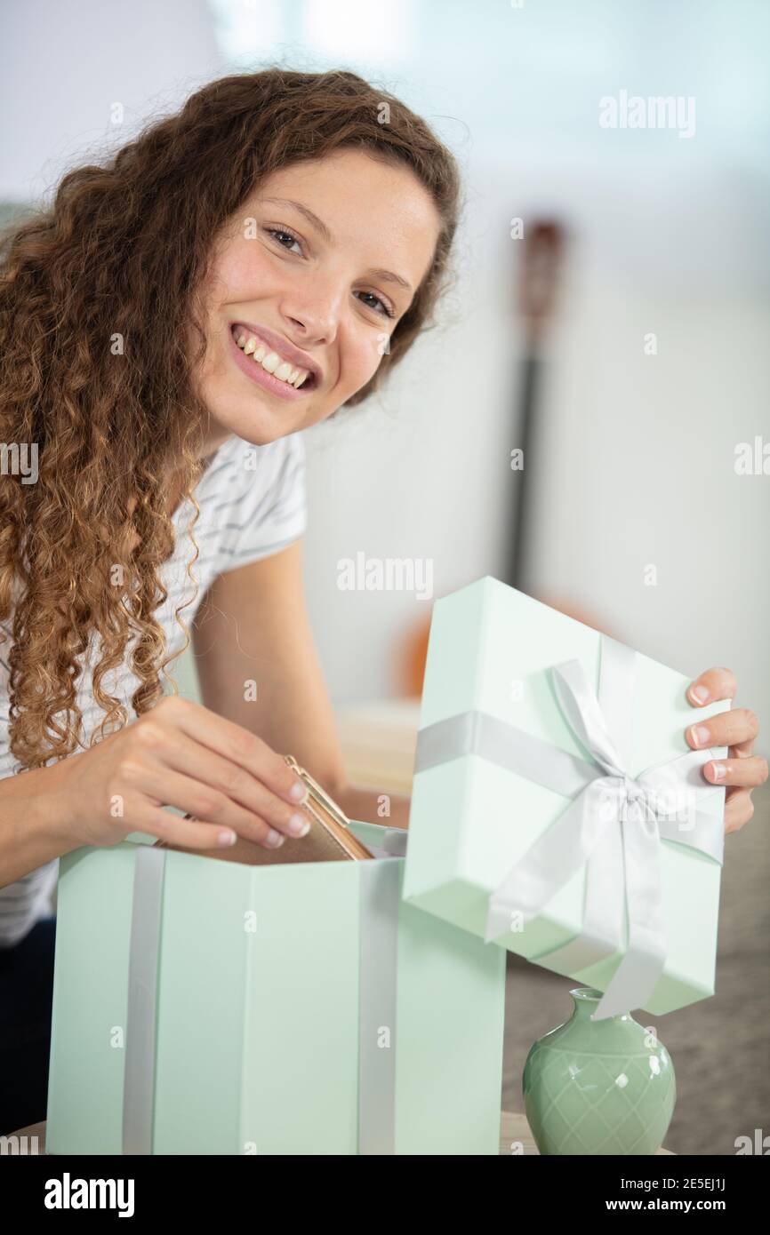picture showing woman opening present Stock Photo - Alamy