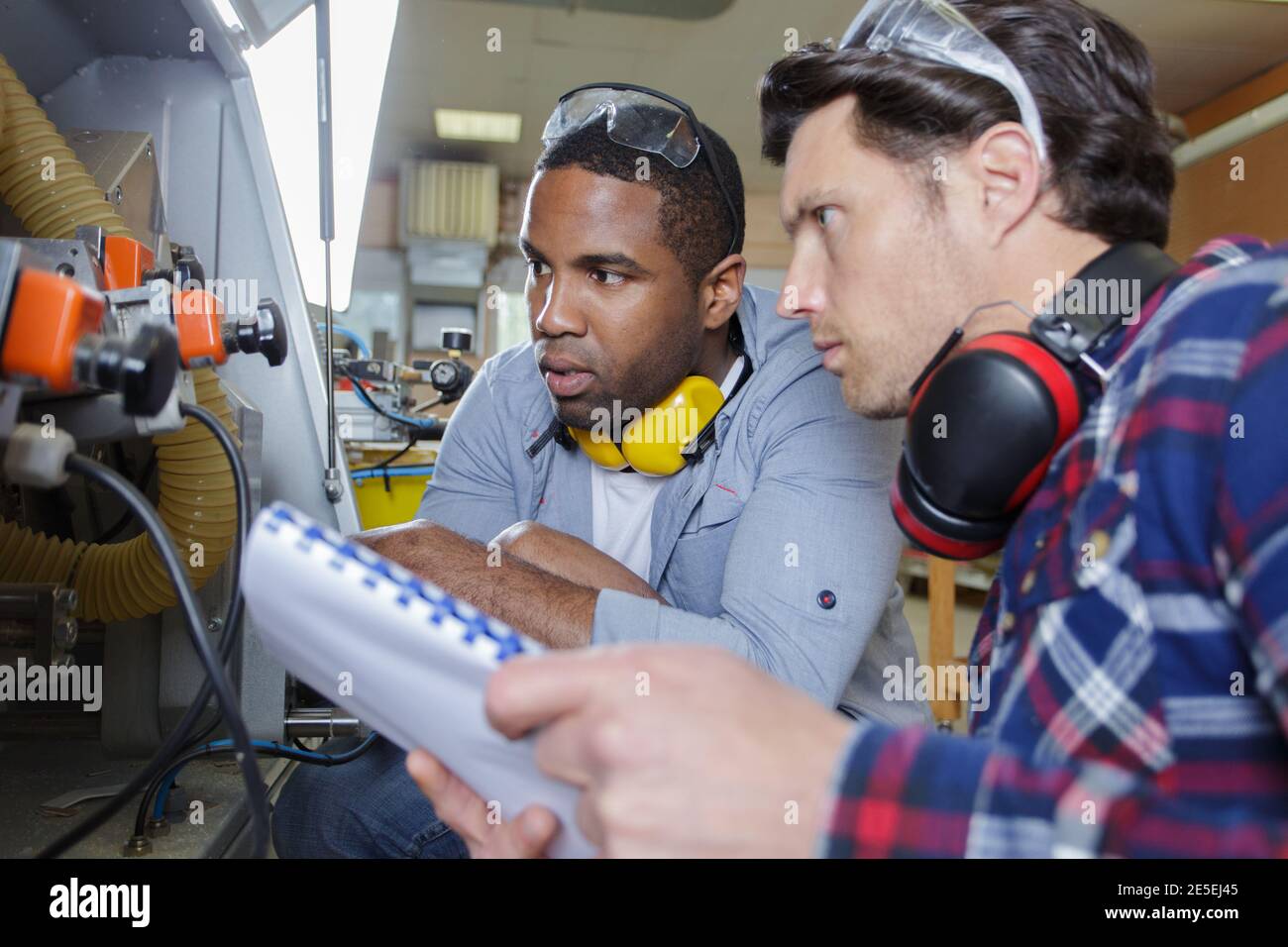 Two men checking metal hi-res stock photography and images - Alamy