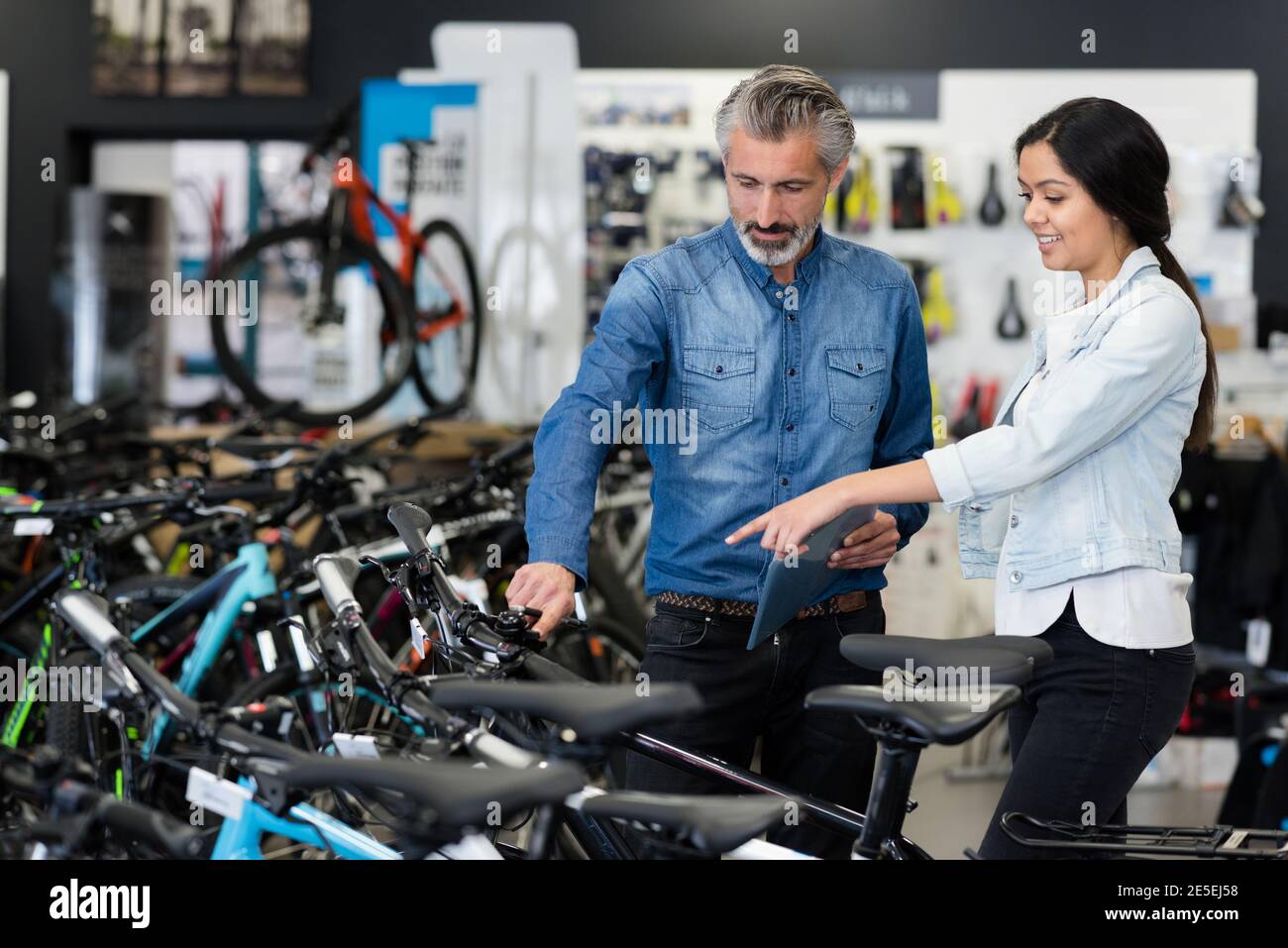 Store manager bicycle shop customer hi-res stock photography and images ...
