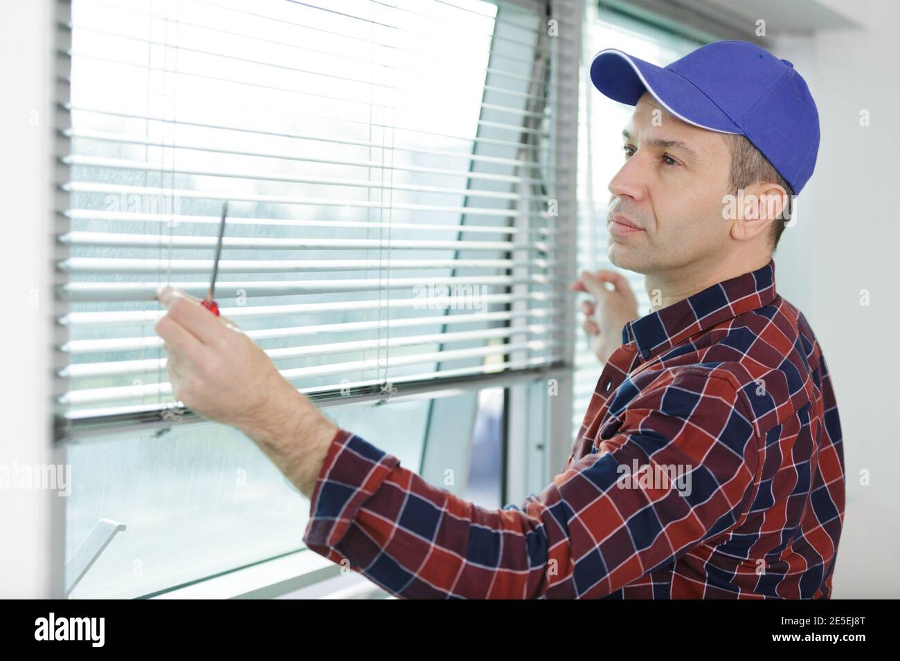 Installing window blinds hi-res stock photography and images - Alamy