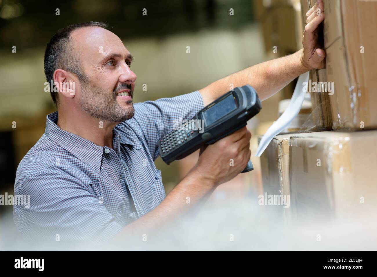 Scanning boxes barcode scanner warehouse hi-res stock photography and ...
