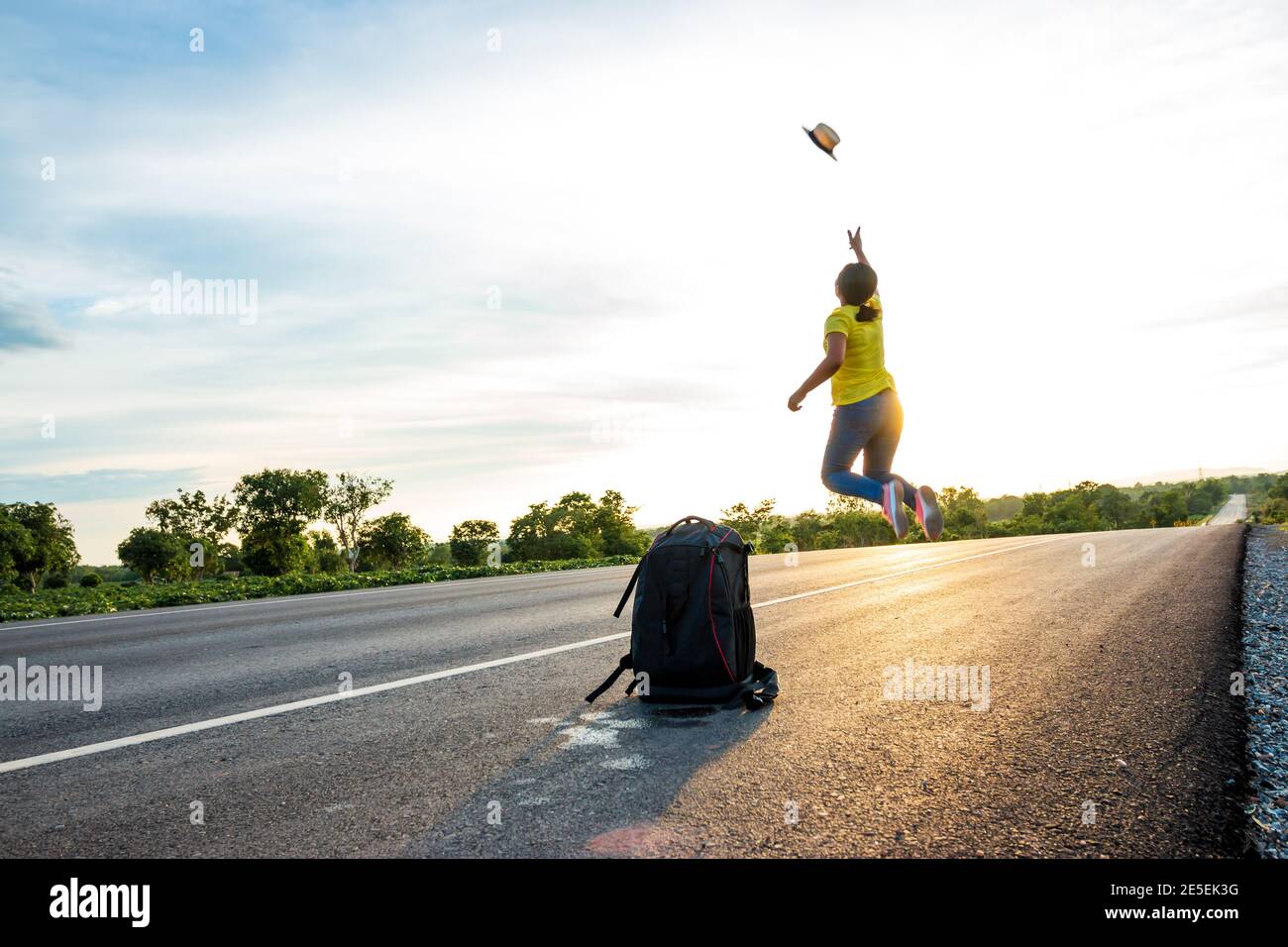 Happy woman jump At the time of the sun set Concept of vacation and ...