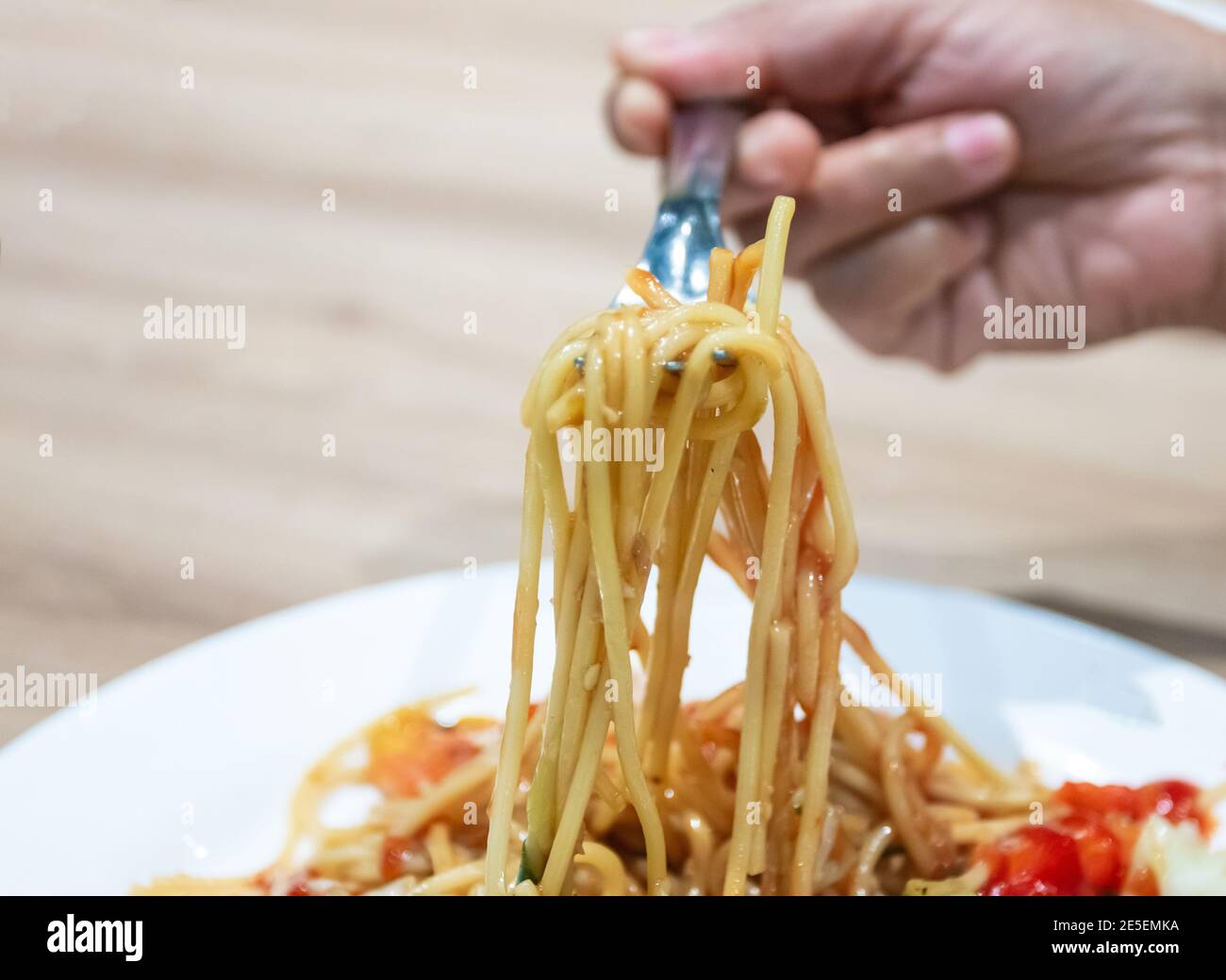 Spaghetti cooked in Thai style, hot and spicy Stock Photo - Alamy