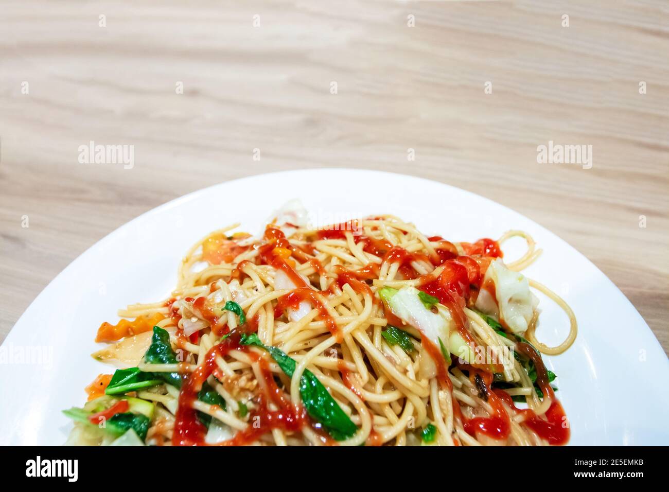 Spaghetti cooked in Thai style, hot and spicy Stock Photo - Alamy