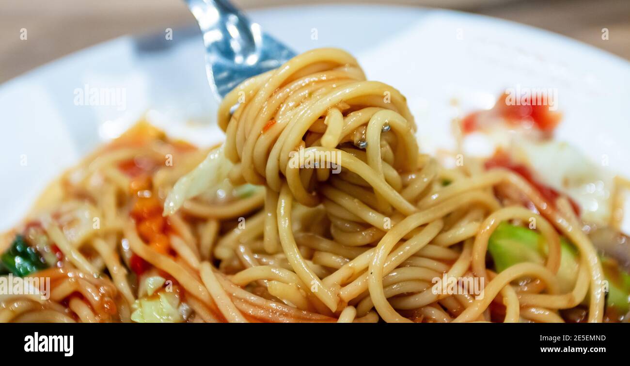 Spaghetti cooked in Thai style, hot and spicy Stock Photo - Alamy