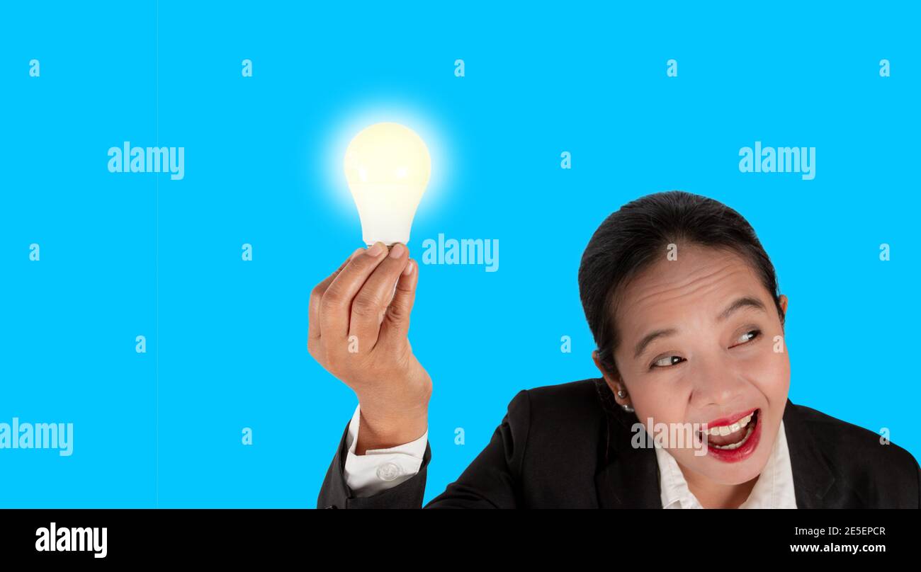 Business women hand holding light bulb, concept of new ideas with ...