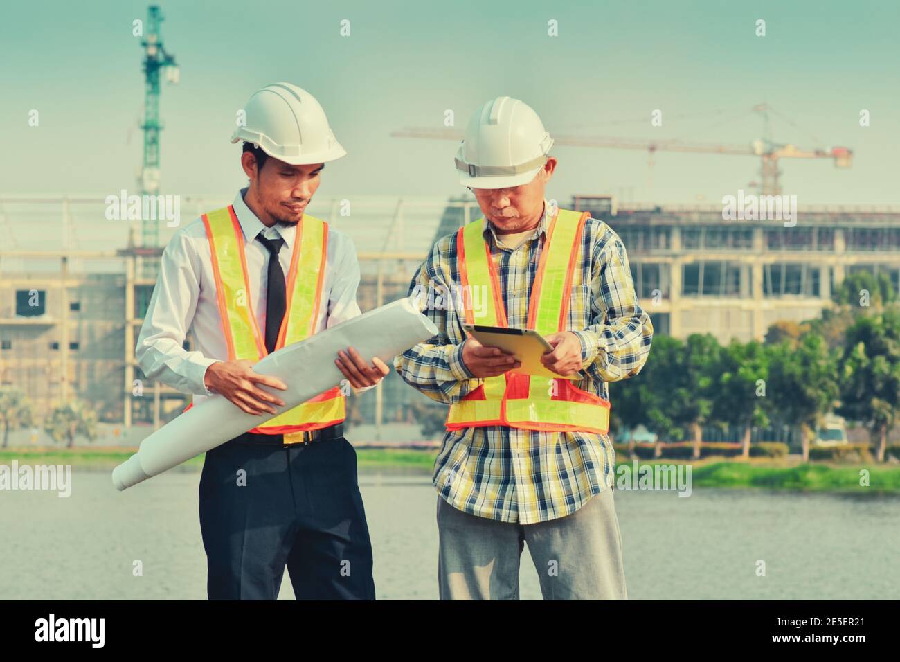 Two Engineer standing on site construction happy success, Two worker ...