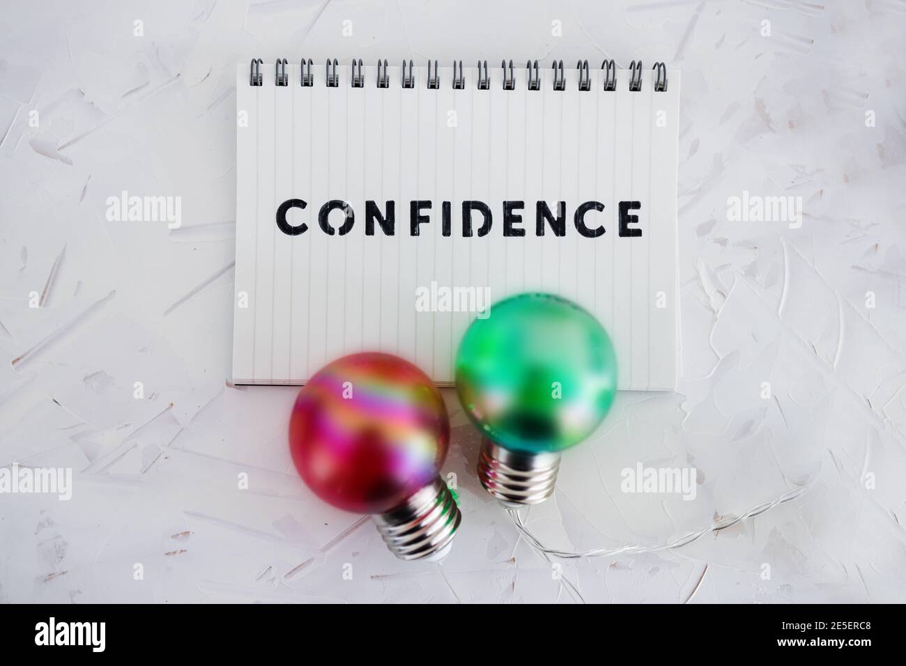 positive attitiude concept, confidence text on notepad surrounded by ...