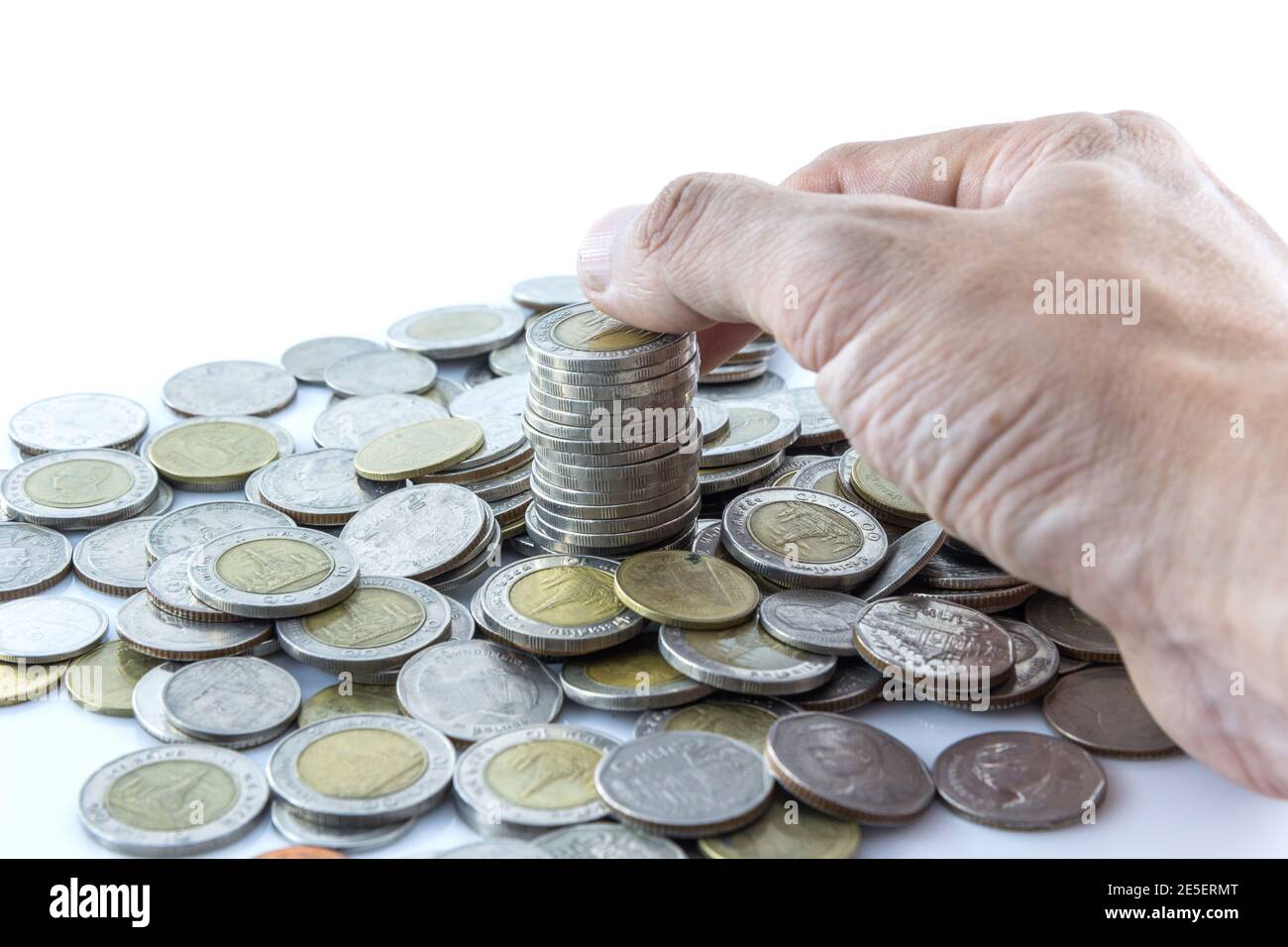 Hand put coin stack hi-res stock photography and images - Alamy