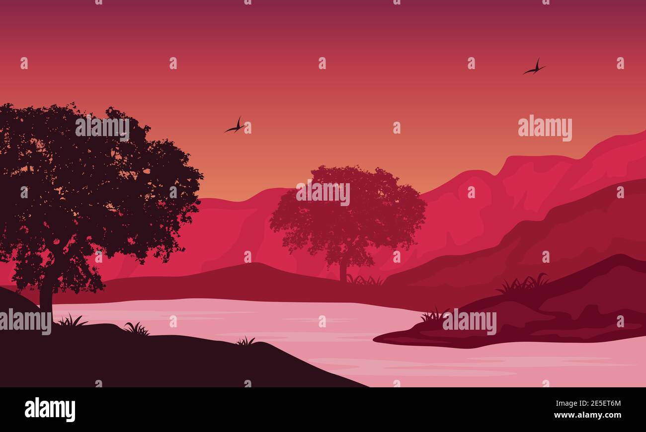 Beautiful sky color at sunset with silhouettes of trees and mountains ...