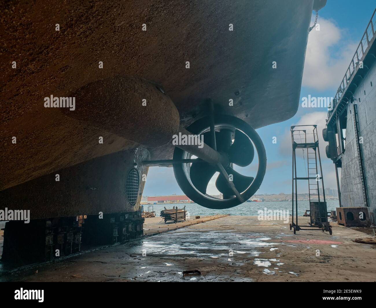 Industry view - Ocean Vessel in the dry dock in shipyard. Old rusty ...