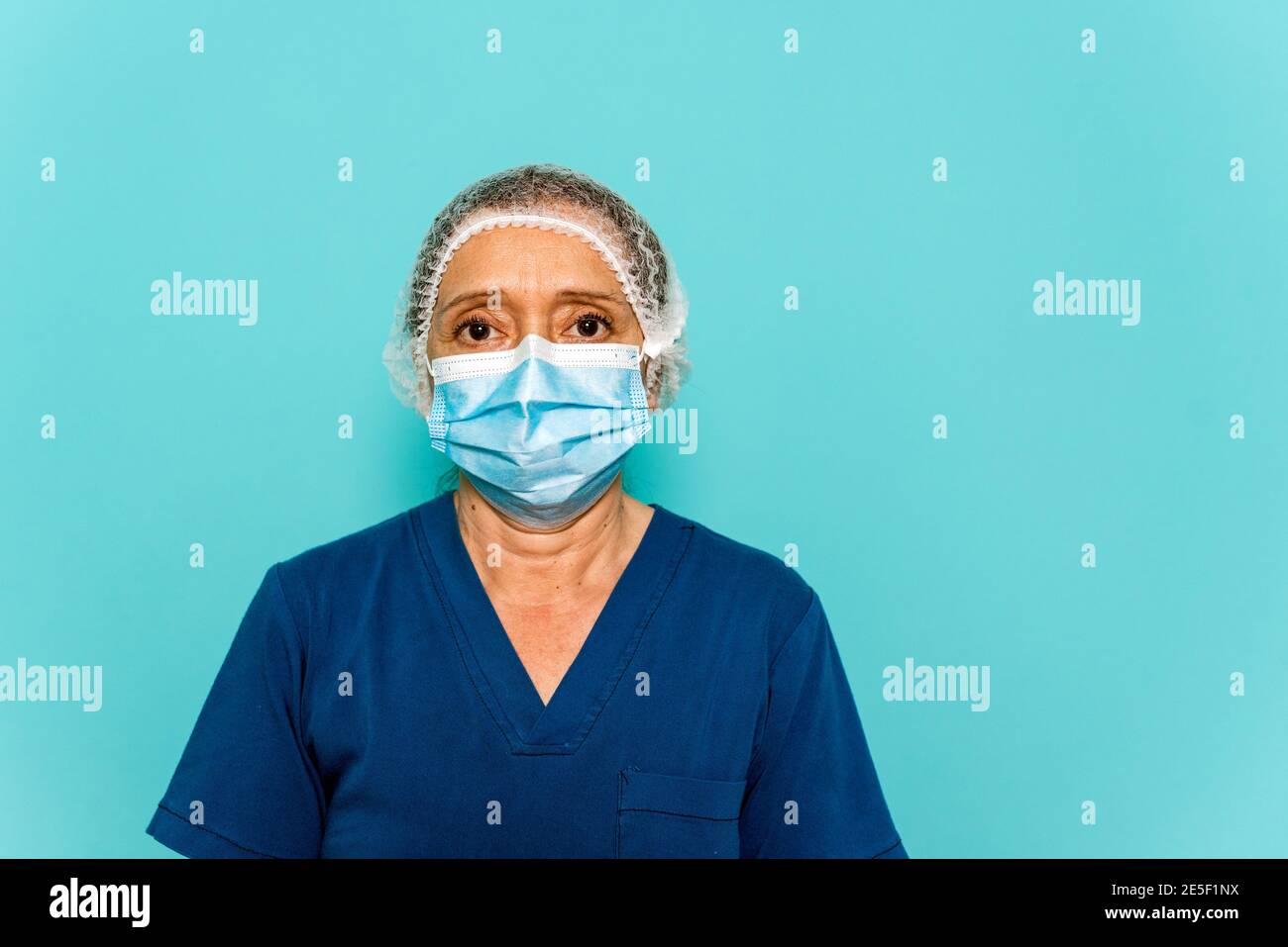 Stock photo of healthcare professional wearing face mask and disposable ...