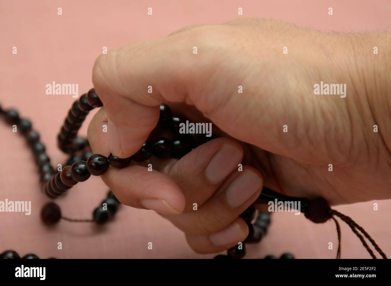 praying using tasbih for muslim Stock Photo - Alamy