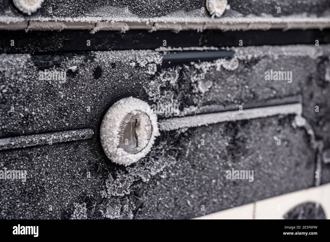 Winter scene of morning crystals fanning out across a metal mailbox and ...