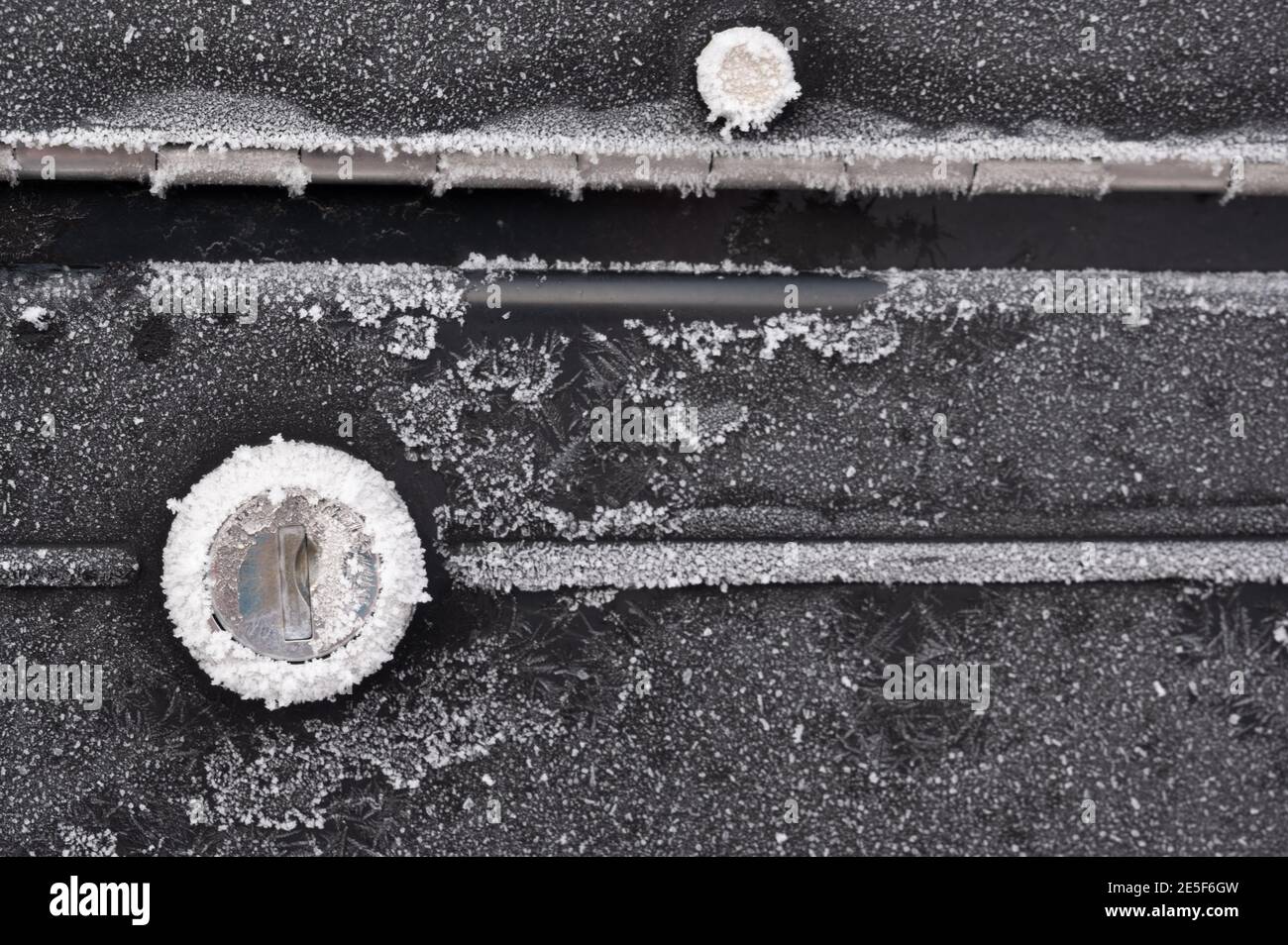 Winter scene of morning crystals fanning out across a metal mailbox and ...