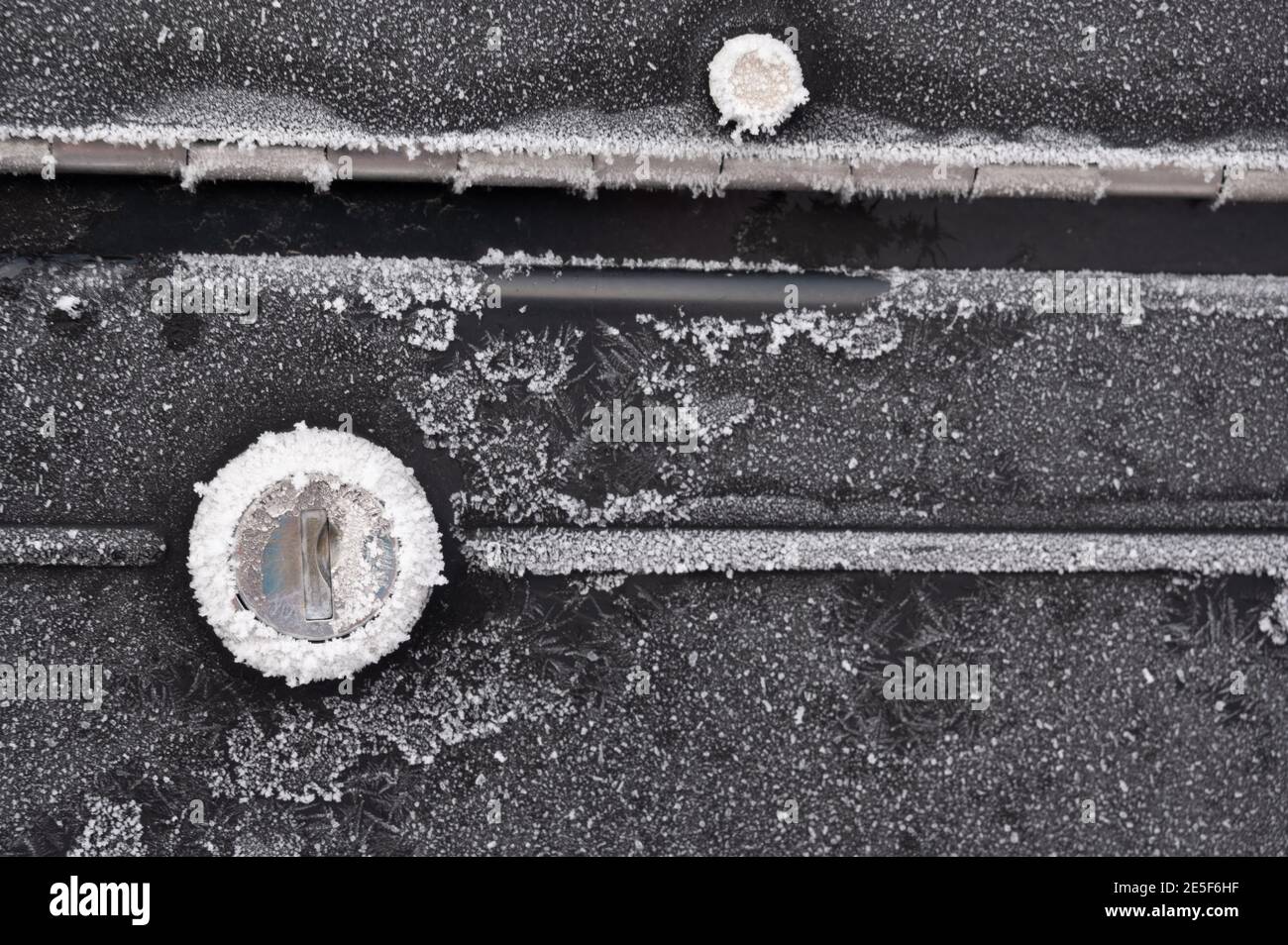 Winter scene of morning crystals fanning out across a metal mailbox and ...