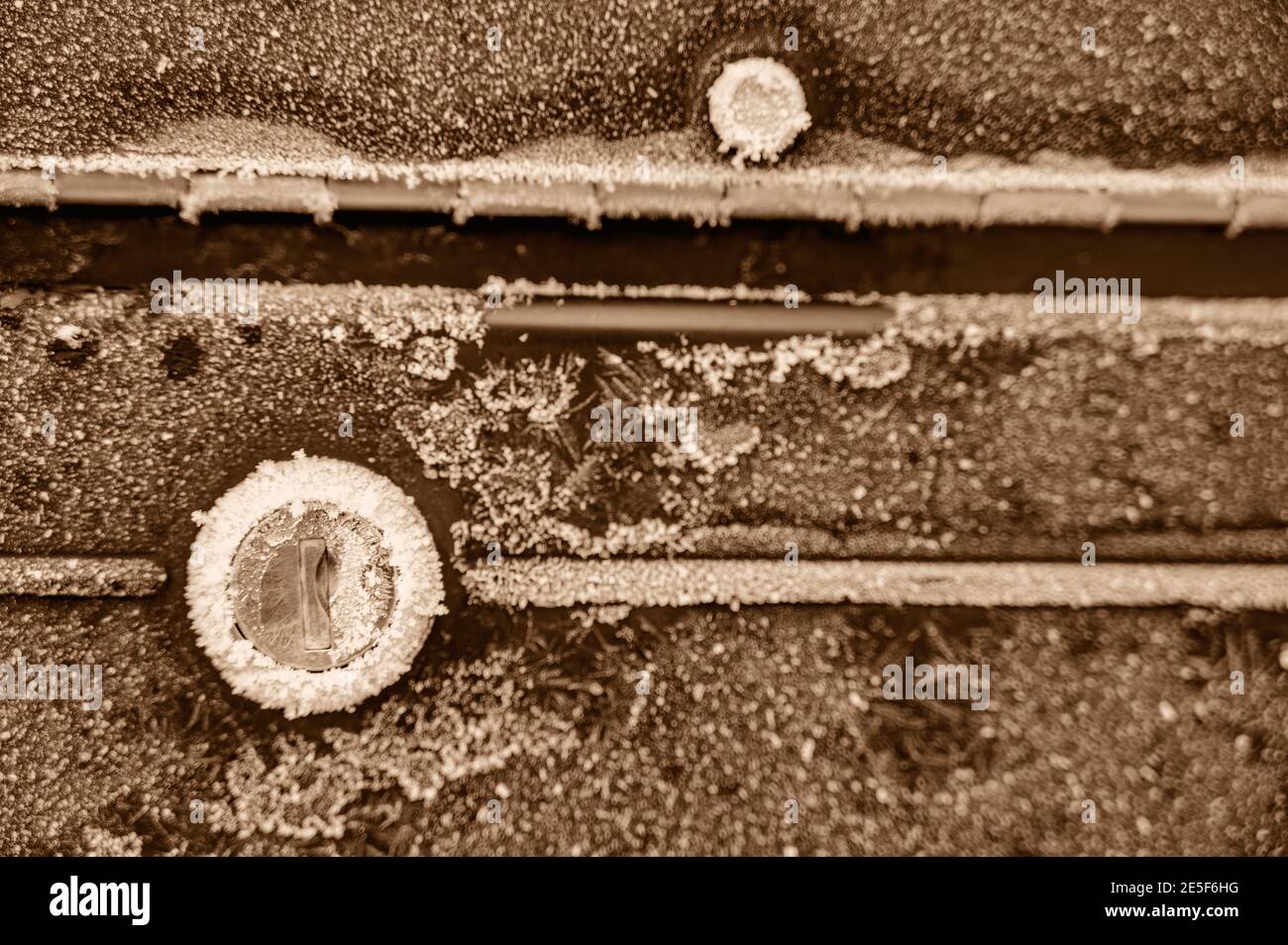 Winter scene of morning crystals fanning out across a metal mailbox and ...