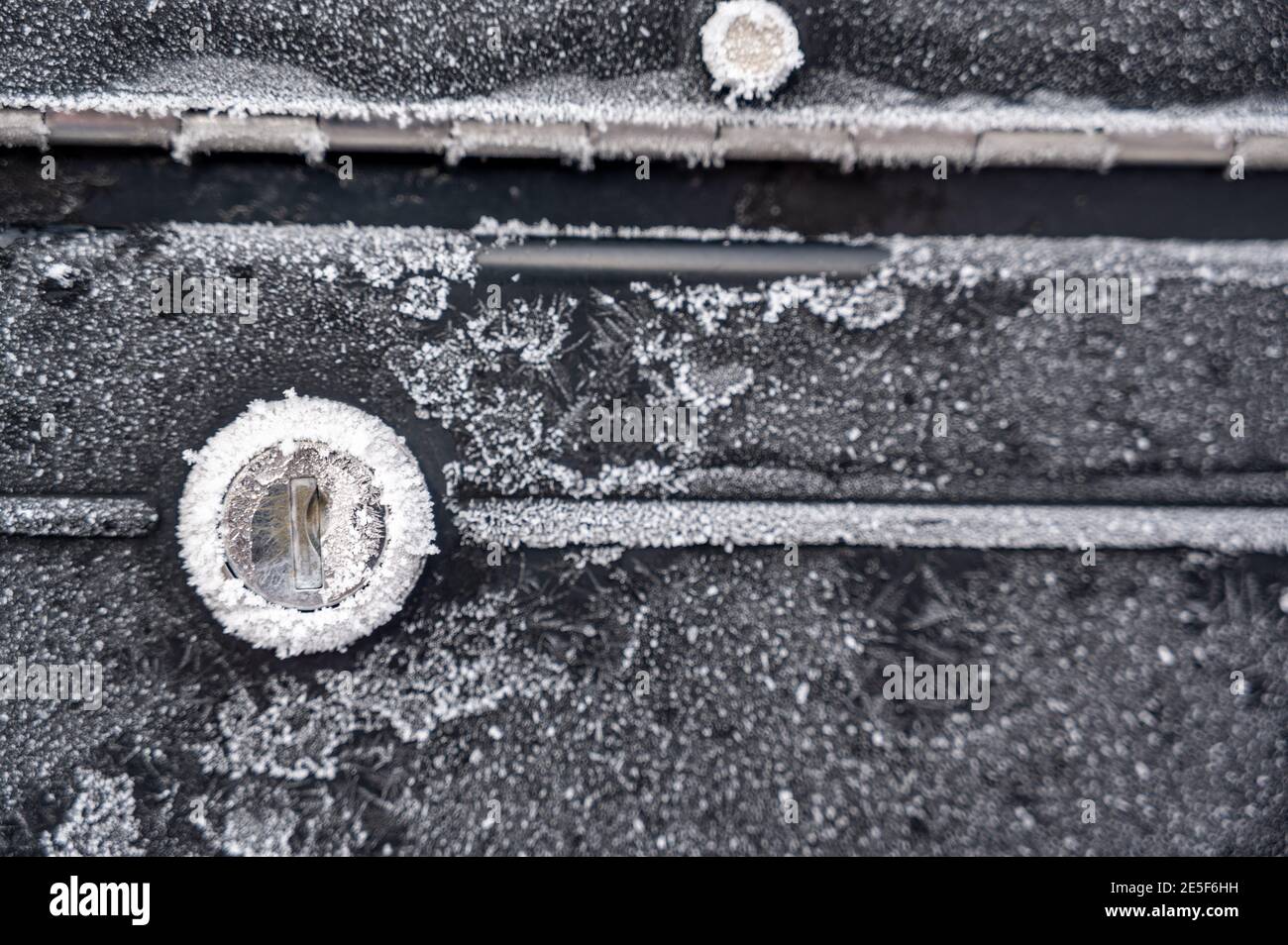Winter scene of morning crystals fanning out across a metal mailbox and ...