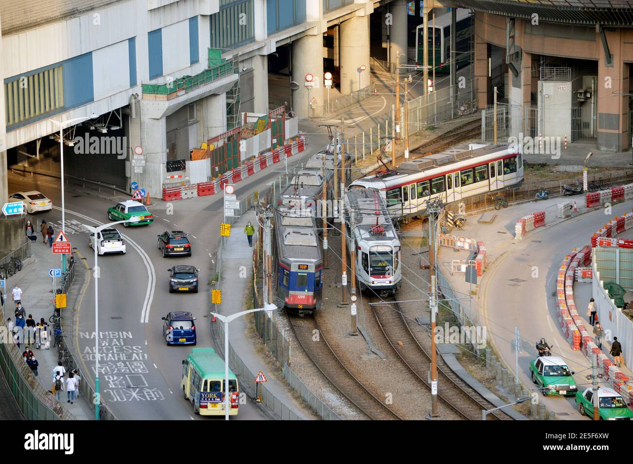 Two two-car light rail trains at entrance to Yuen Long Terminus in Hong ...
