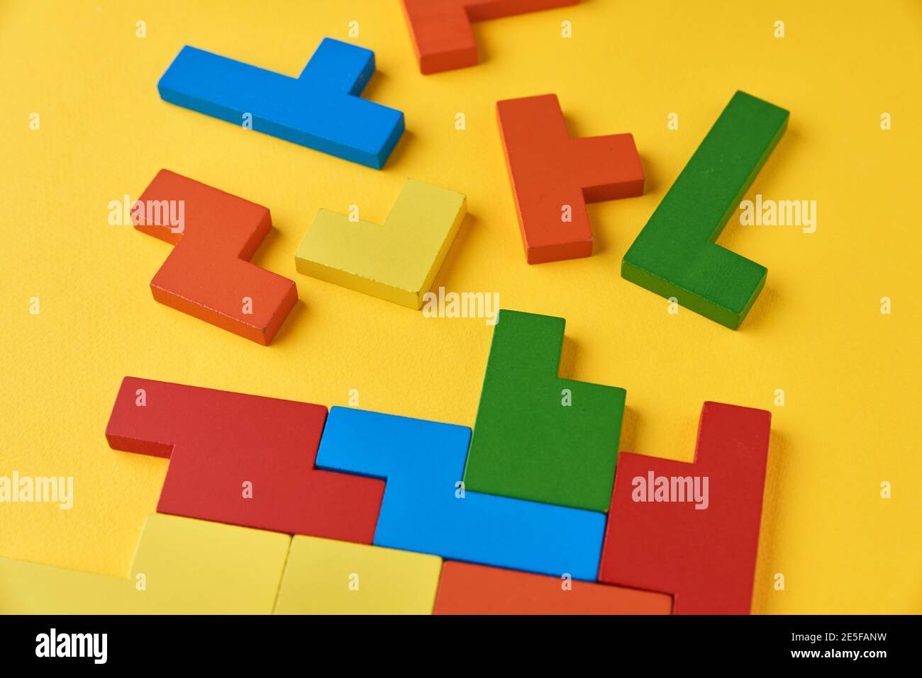 Different wooden blocks on a yellow background. Concept of logical ...