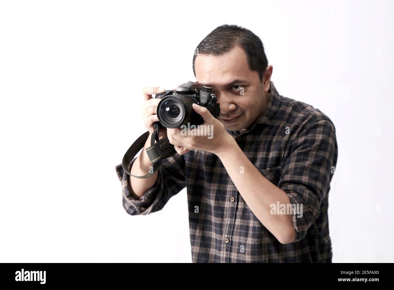 a man with camera, photographer with camera, making picture with his ...