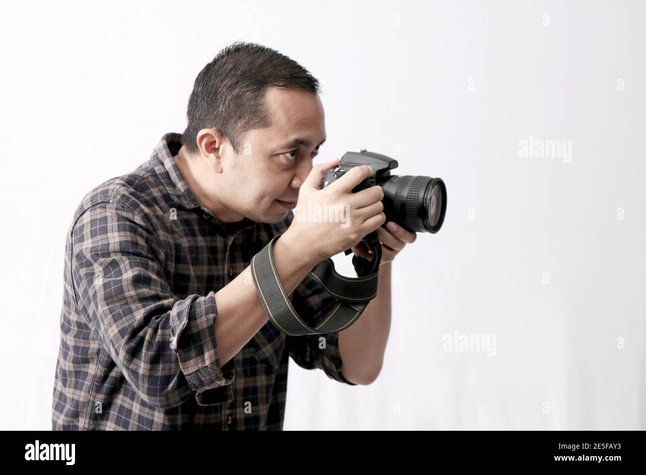 a man with camera, photographer with camera, making picture with his ...