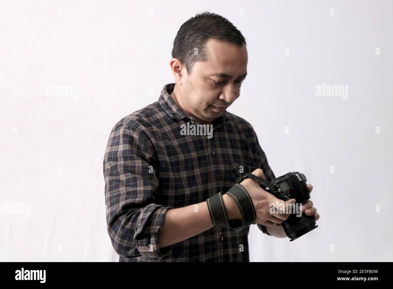 a man with camera, photographer with camera, making picture with his ...