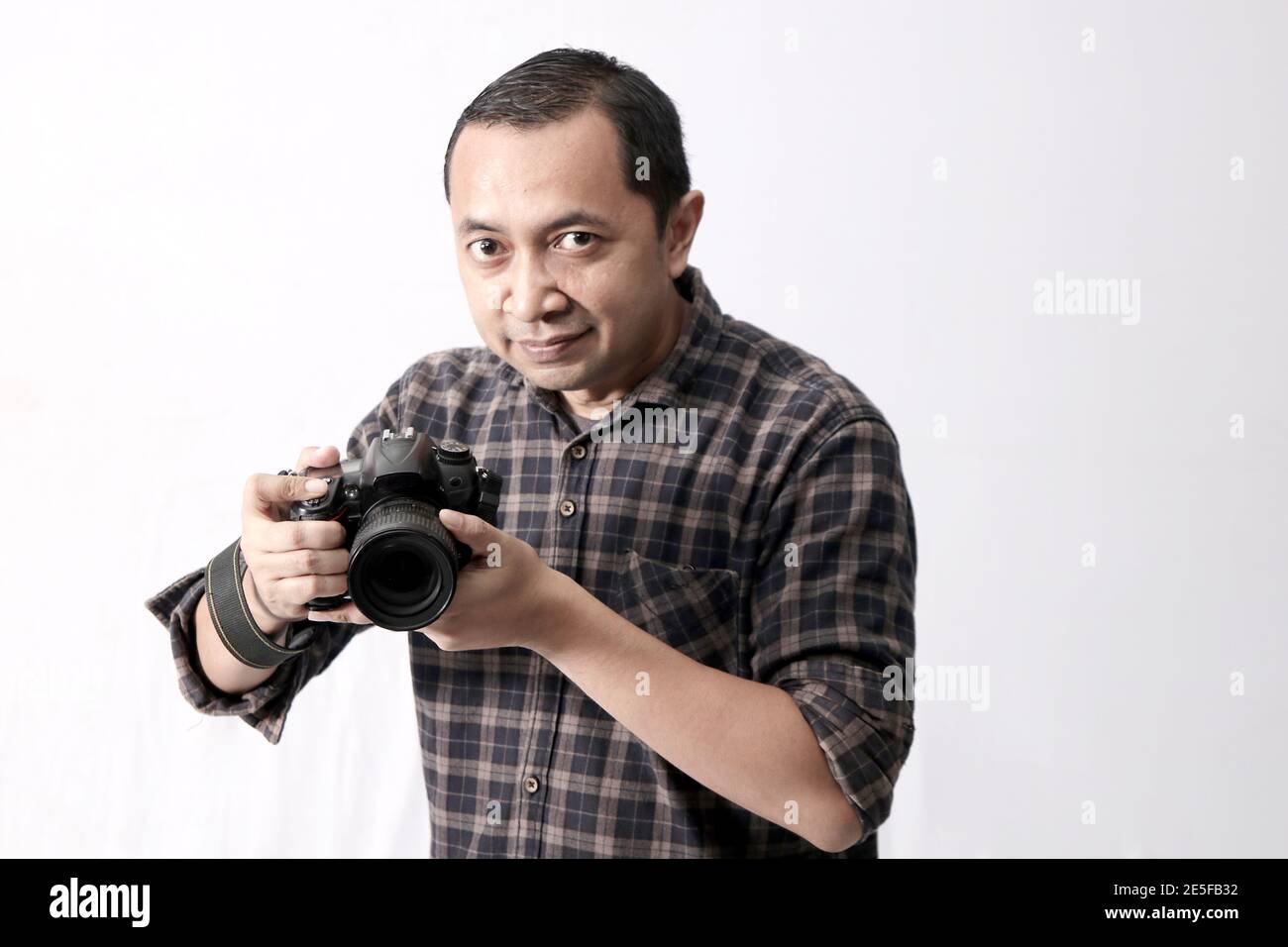 a man with camera, photographer with camera, making picture with his ...