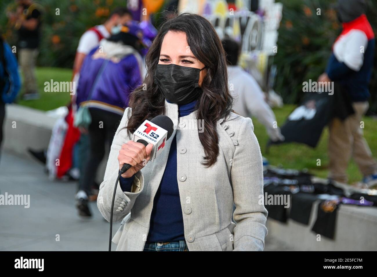 Telemundo 52 reporter Sandra O’Neill gathers news at a memorial for ...