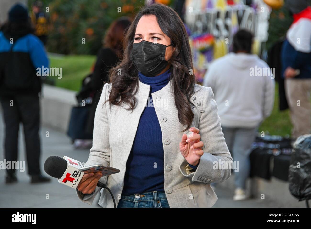 Telemundo 52 reporter Sandra O’Neill gathers news at a memorial for ...