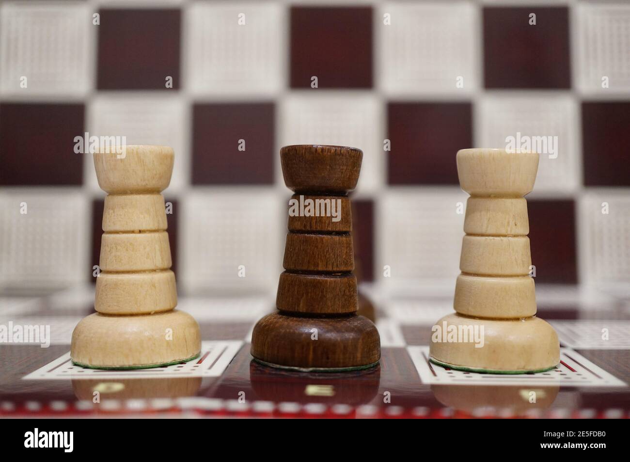 Close-up shot of black and white wooden Rooks on the chess board Stock ...