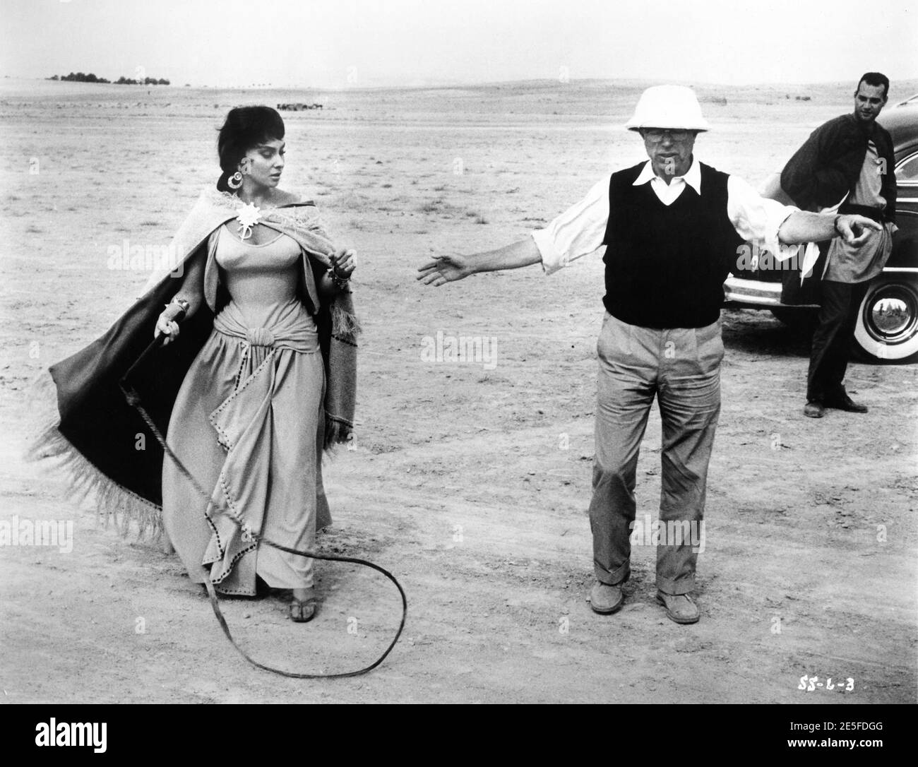 GINA LOLLOBRIGIDA practices with Whip on set location candid with ...