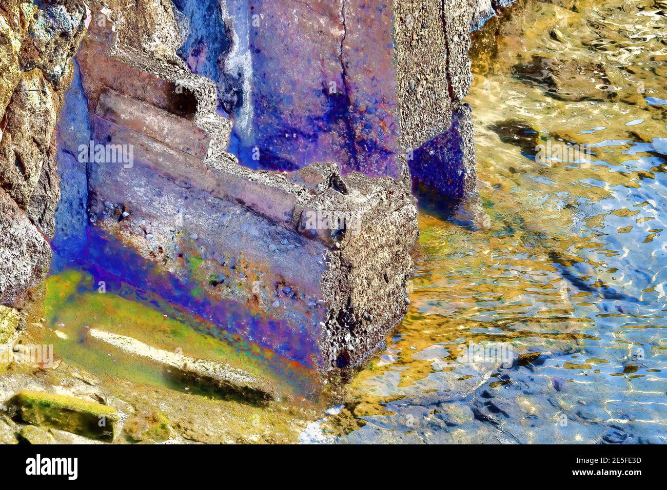 Stone and concrete water outlet is weathering away into a river Stock ...