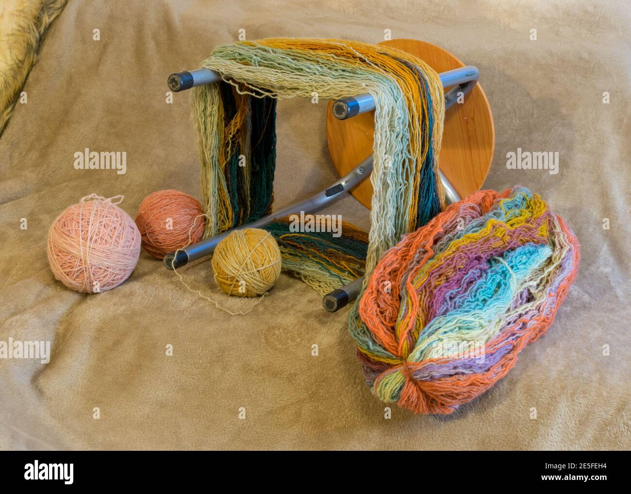 picture with yarn spools and balls of wool thread, skeins prepared for ...