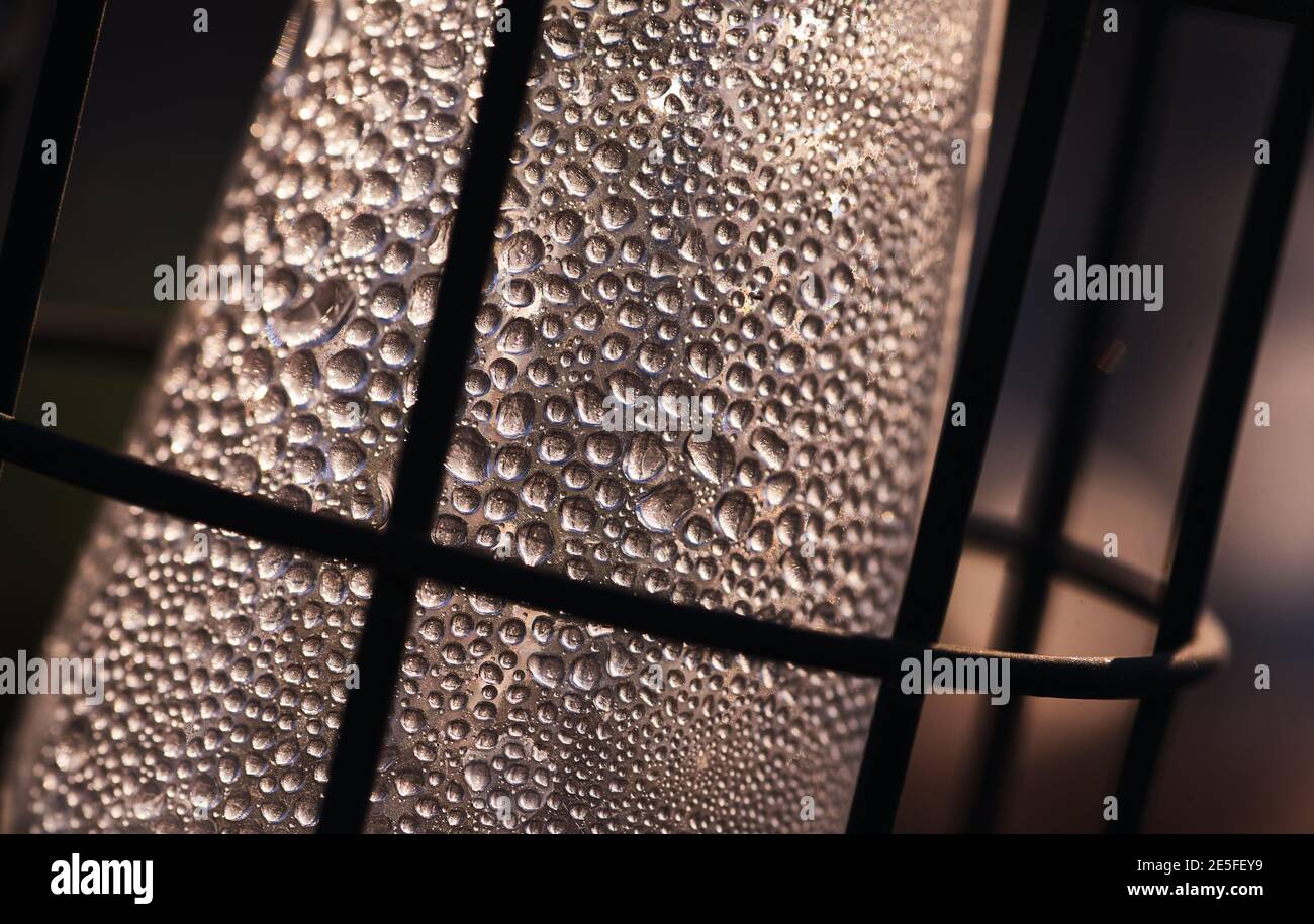 Water droplets from the condensation of water vapor in the lamp Stock ...