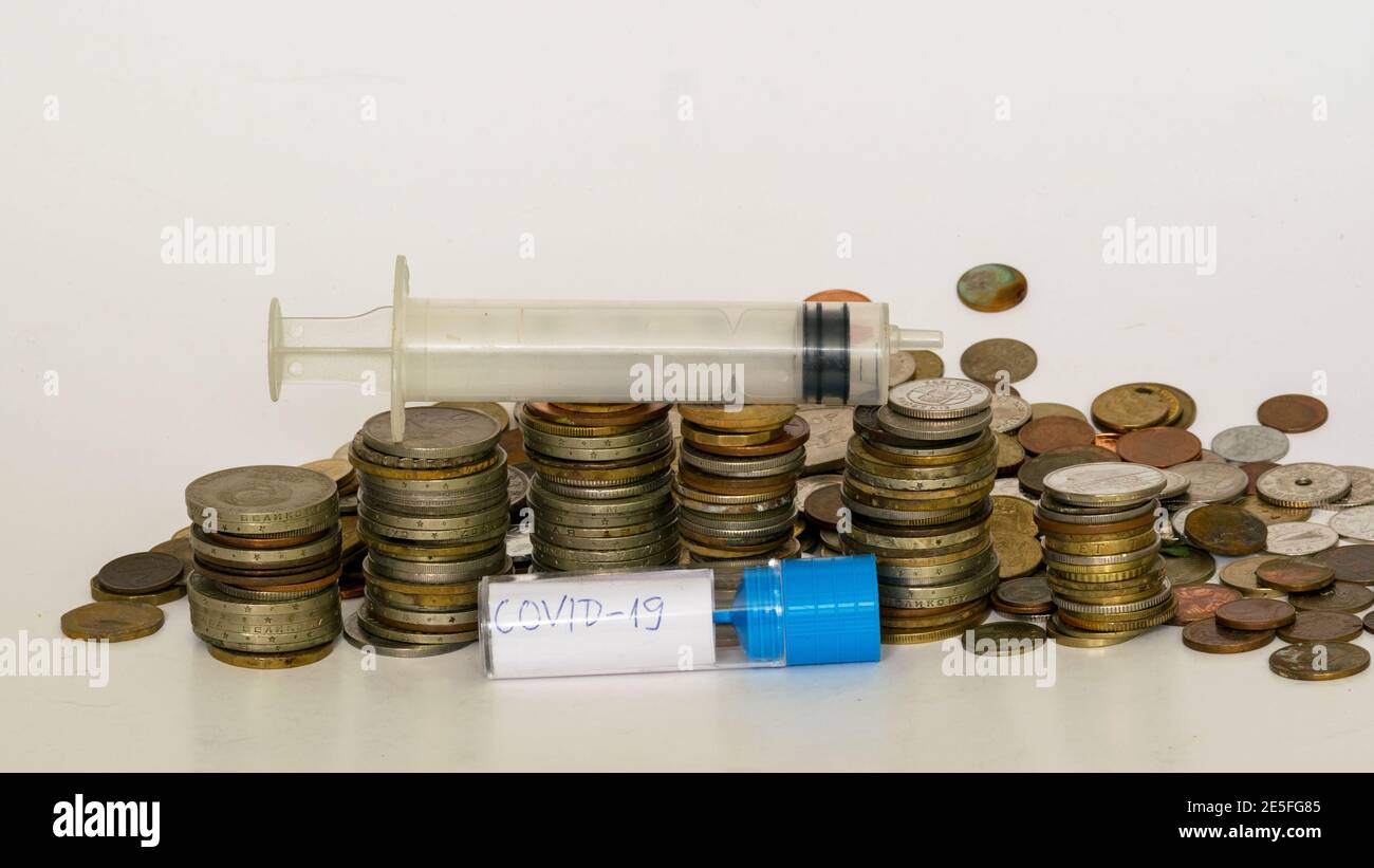 a photograph with metal coins of various shapes, countries and values ...