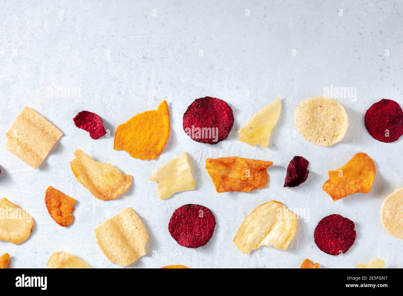 Vegetable chips, overhead flat lay shot. Healthy vegan snack, an ...