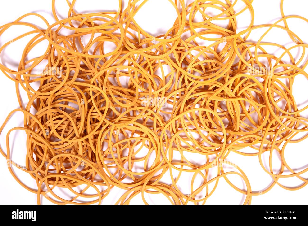 Yellow rubber elastics isolated on a white background Stock Photo - Alamy