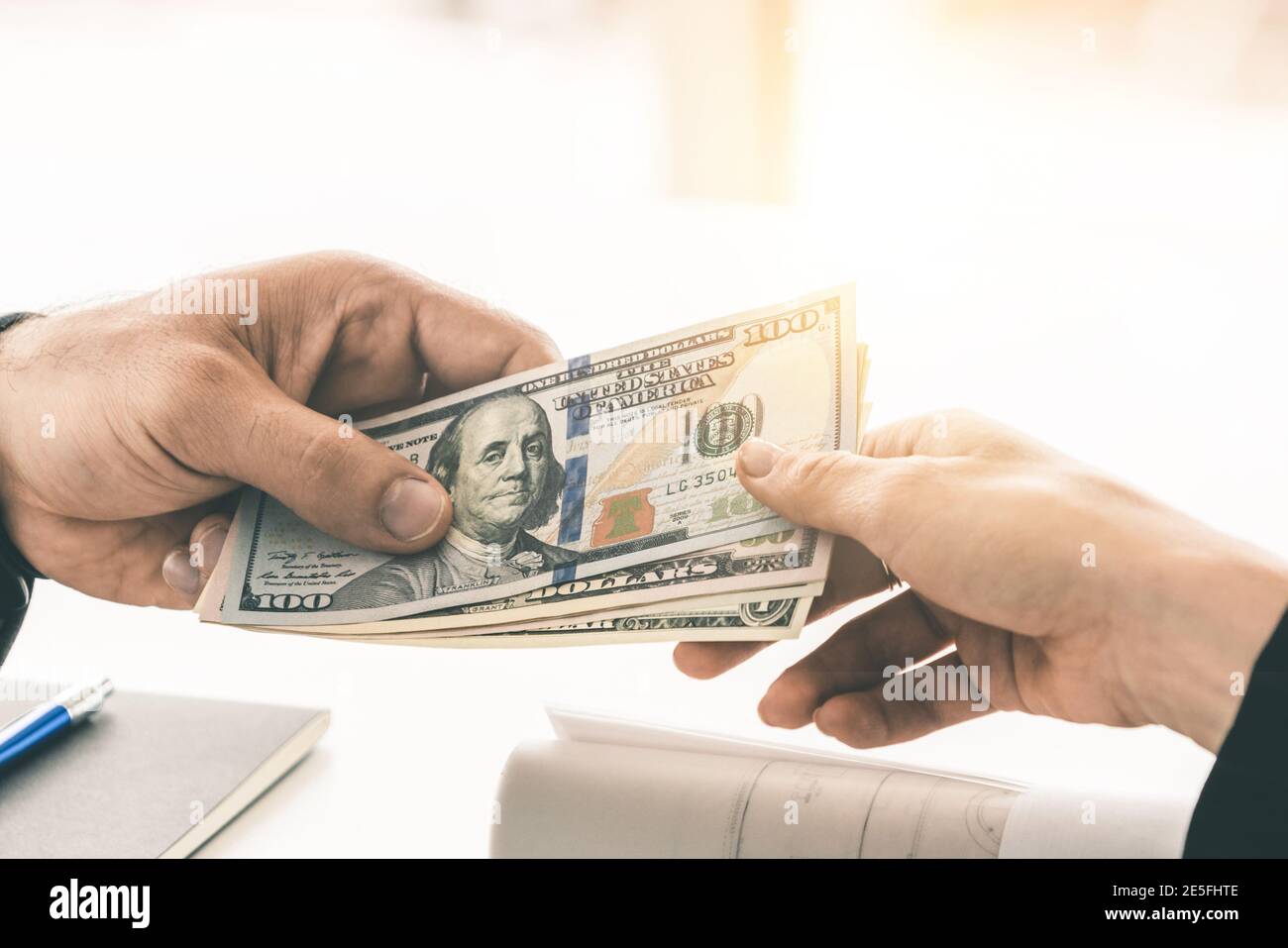 Hand giving paper another hand hi-res stock photography and images - Alamy